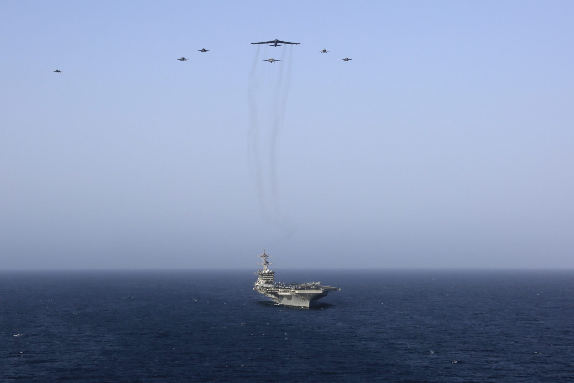 Watch new footage of US bomber, fighter jets and more fly over carrier USS Abraham Lincoln at ...