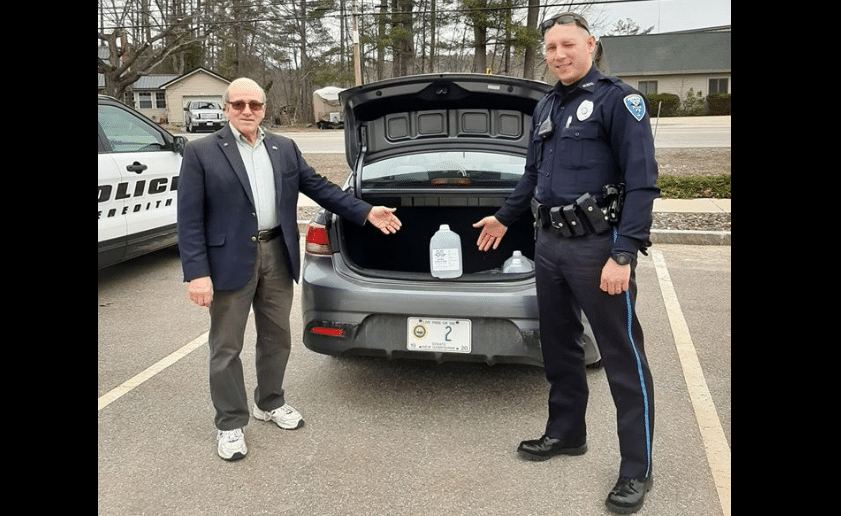 Former Marine attack pilot Bob Giuda hands out gallons of sanitizer and ...