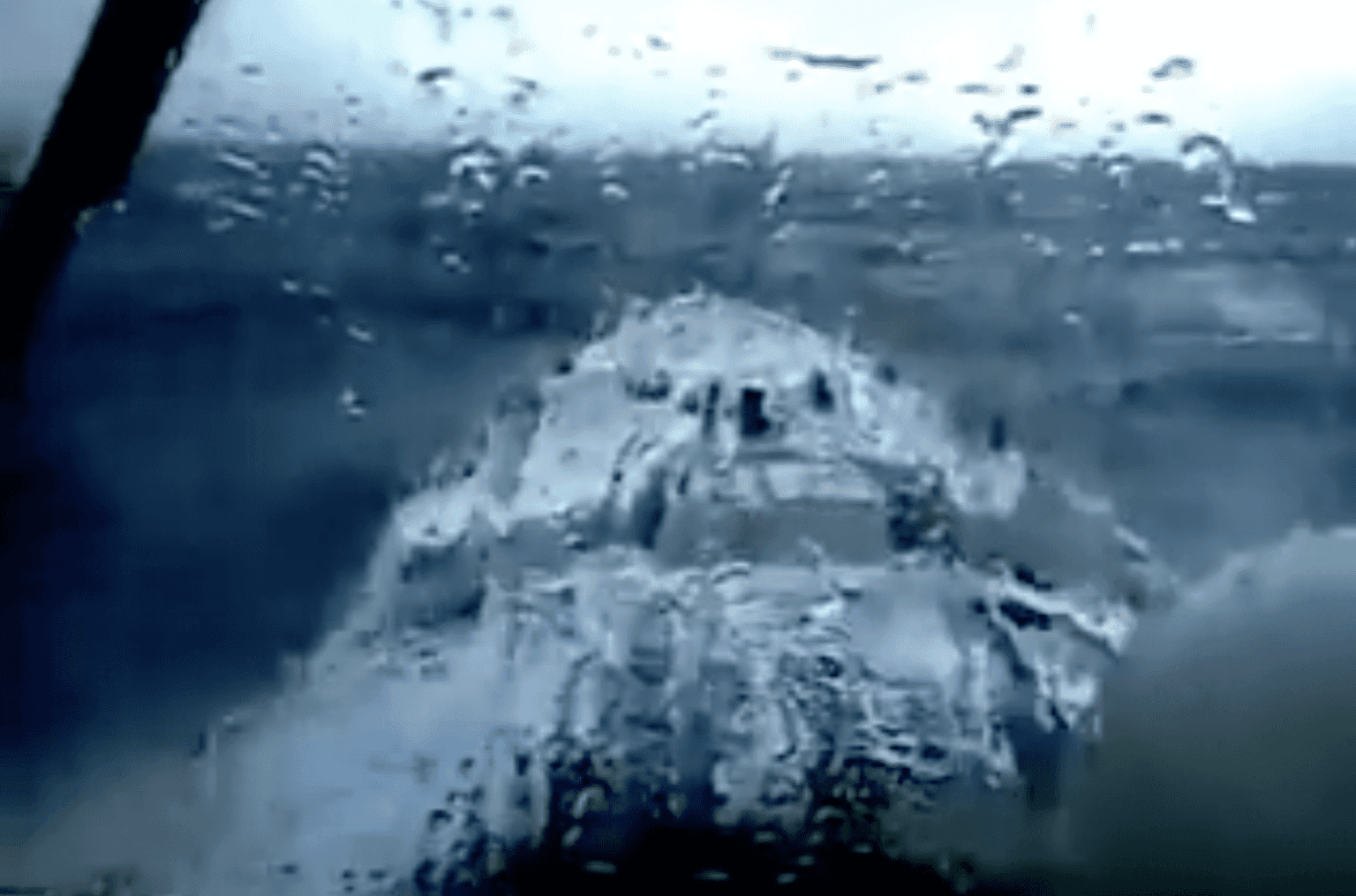 Watch this massive rogue wave nearly submerge this Navy vessel ...