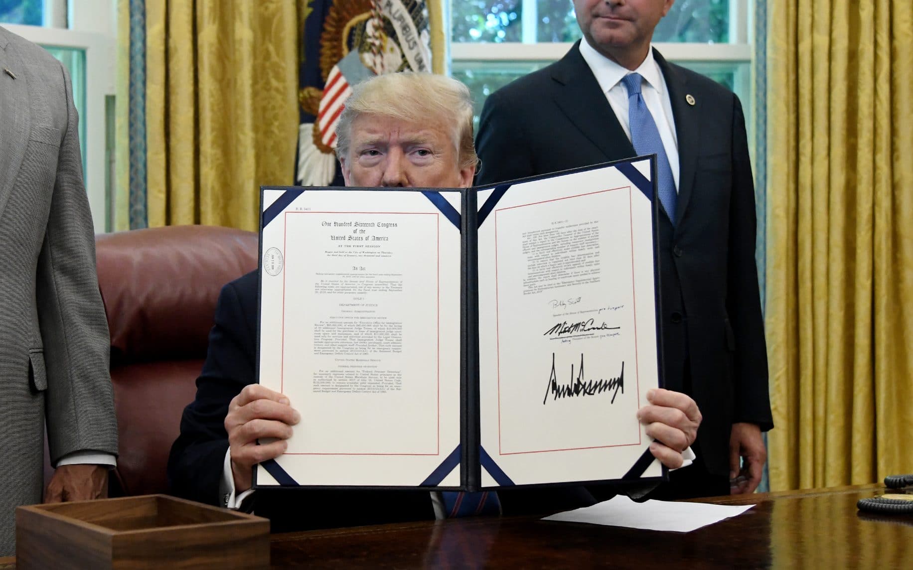 Trump signs $4.59 billion border aid package into law | American ...