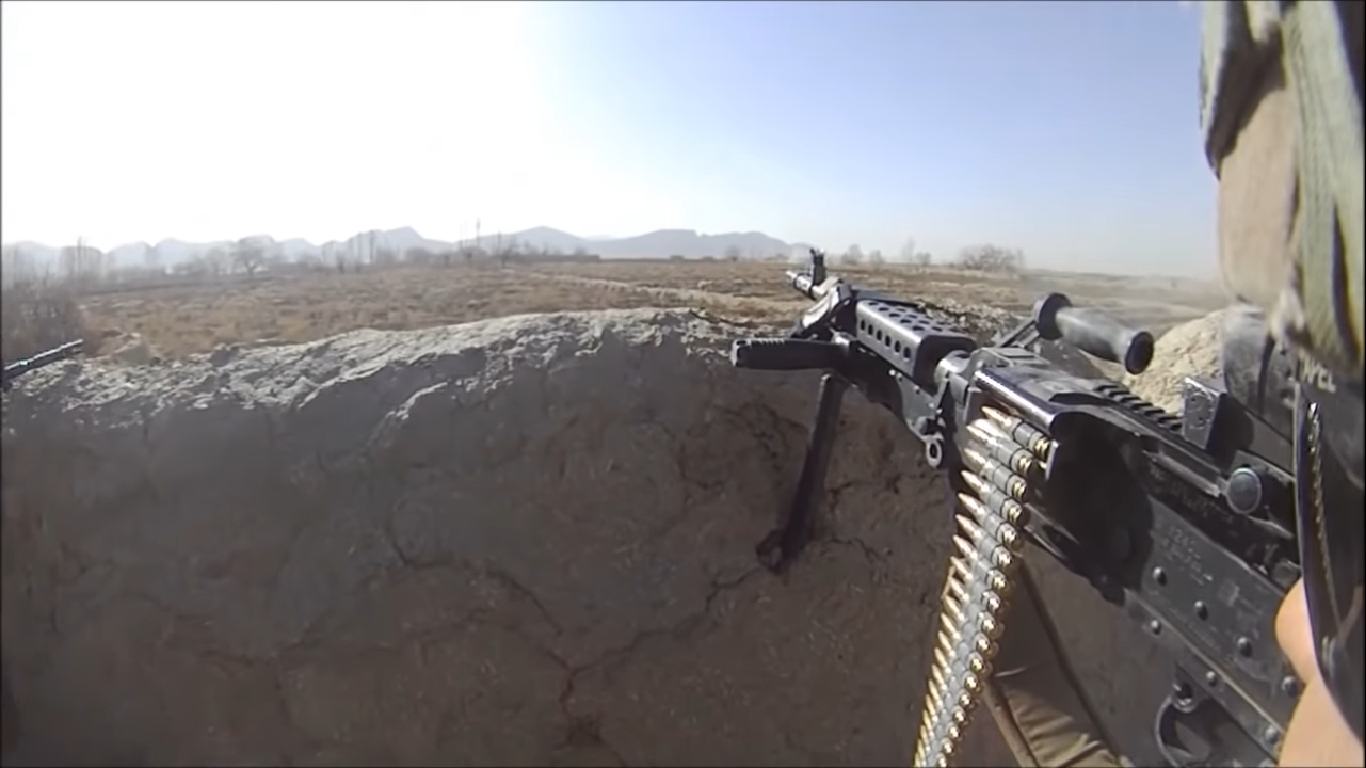 See a M240 gunner in combat ducking bullets and returning fire ...