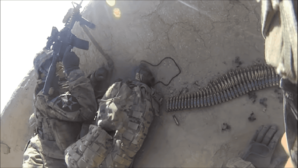See a M240 gunner in combat ducking bullets and returning fire ...